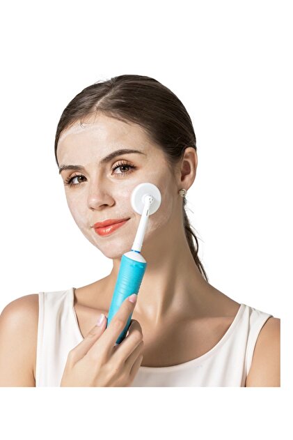 using electric toothbrush on face