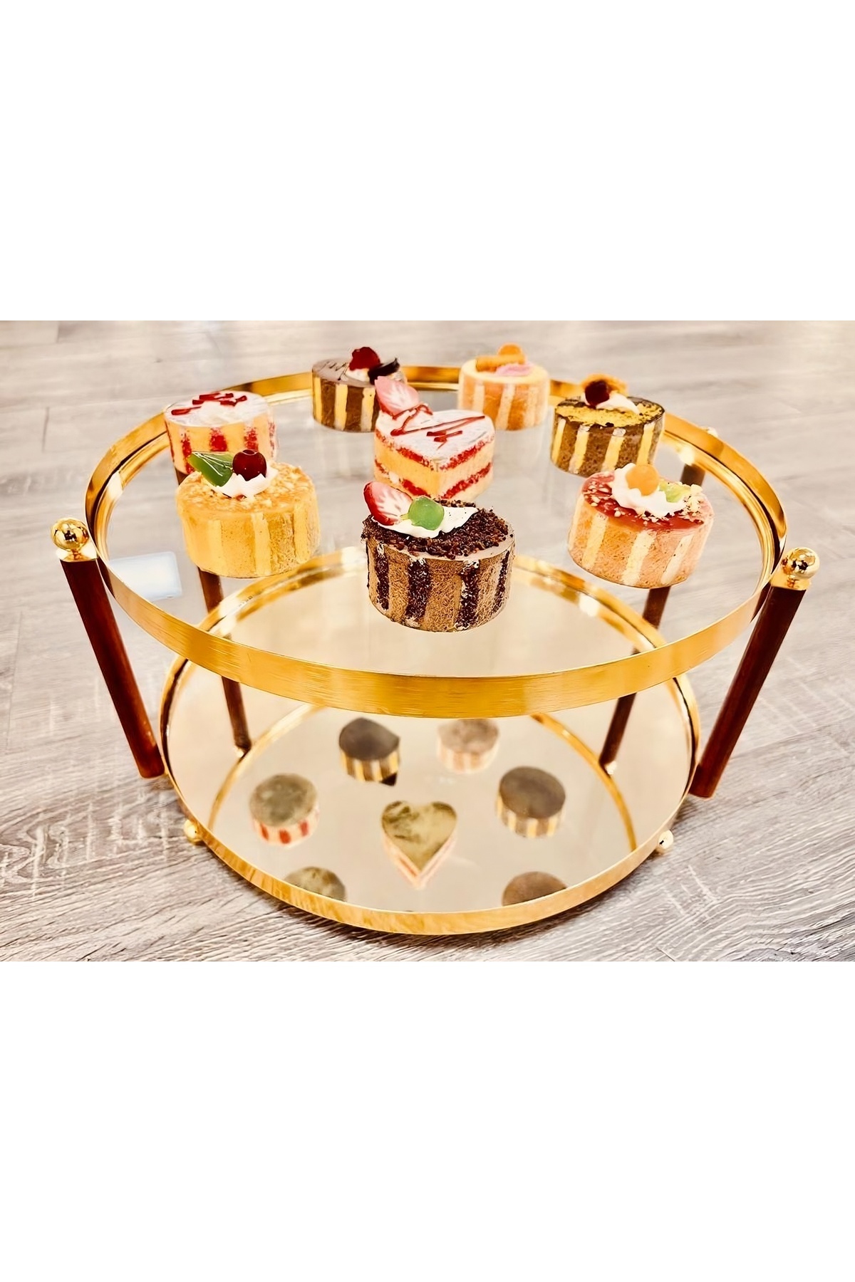 GENERAL Large two-tier cake plate with mirrors, a gold frame, and ...